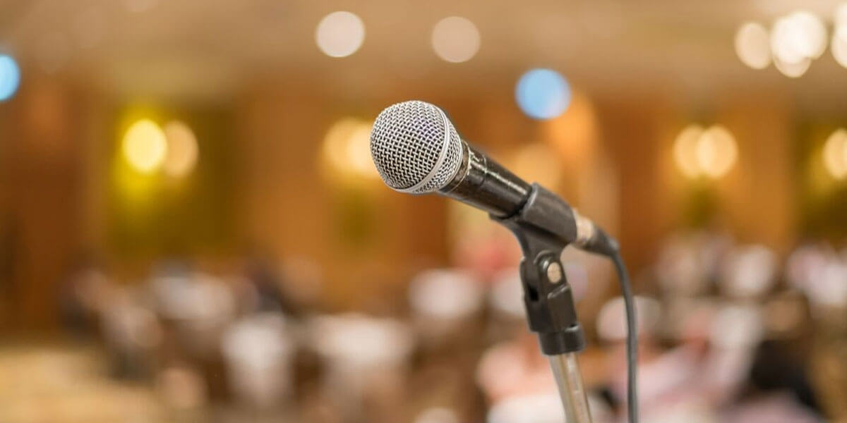 Speaking at a conference. - Presenting Success